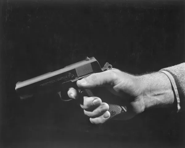 Hand Holding Gun Up